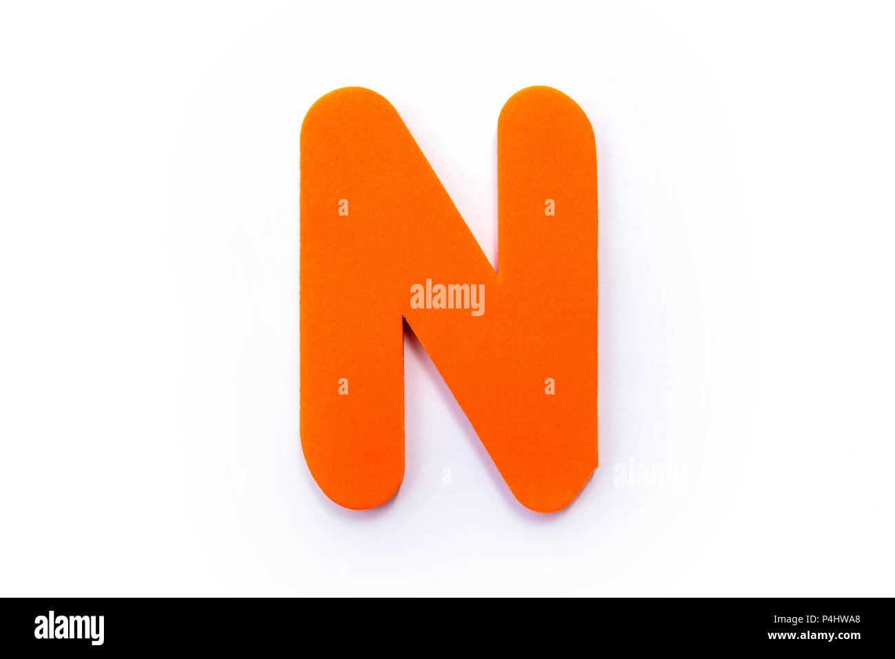 Orange Letter N over a white background Stock Photo - Alamy