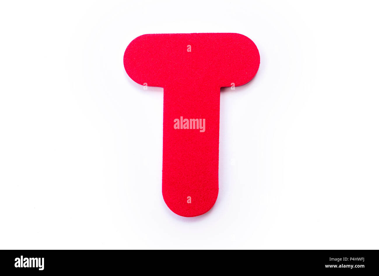 Red Letter T over a white background Stock Photo - Alamy