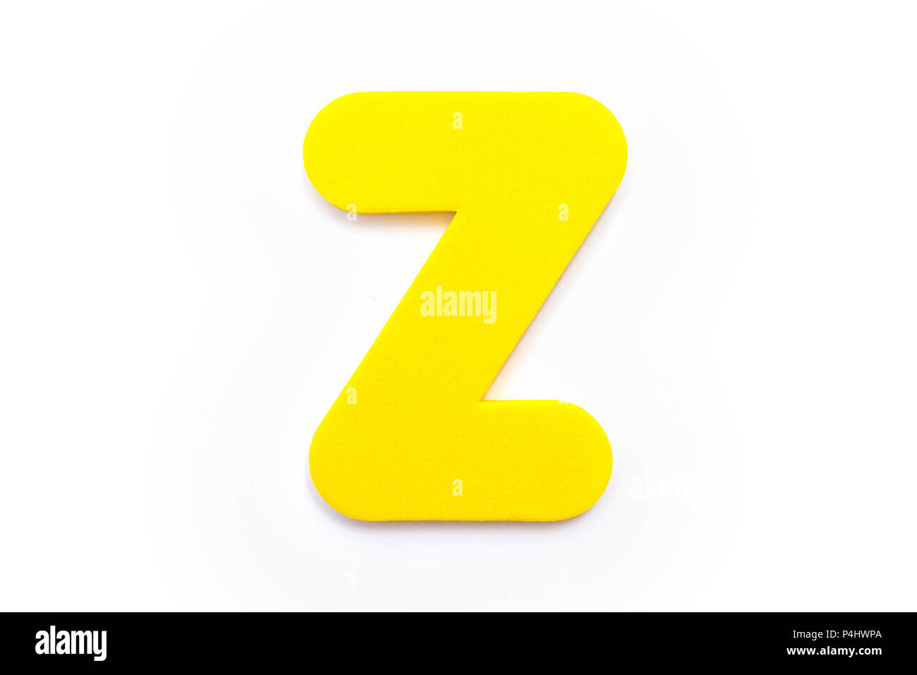 Yellow Letter Z over a white background Stock Photo - Alamy