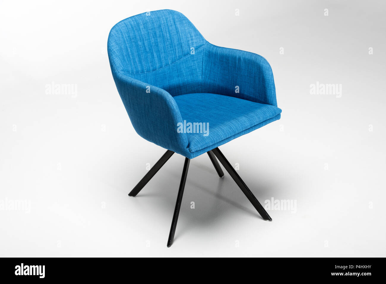 Studio shot of stylish chair with blue fabric top and triangular ...