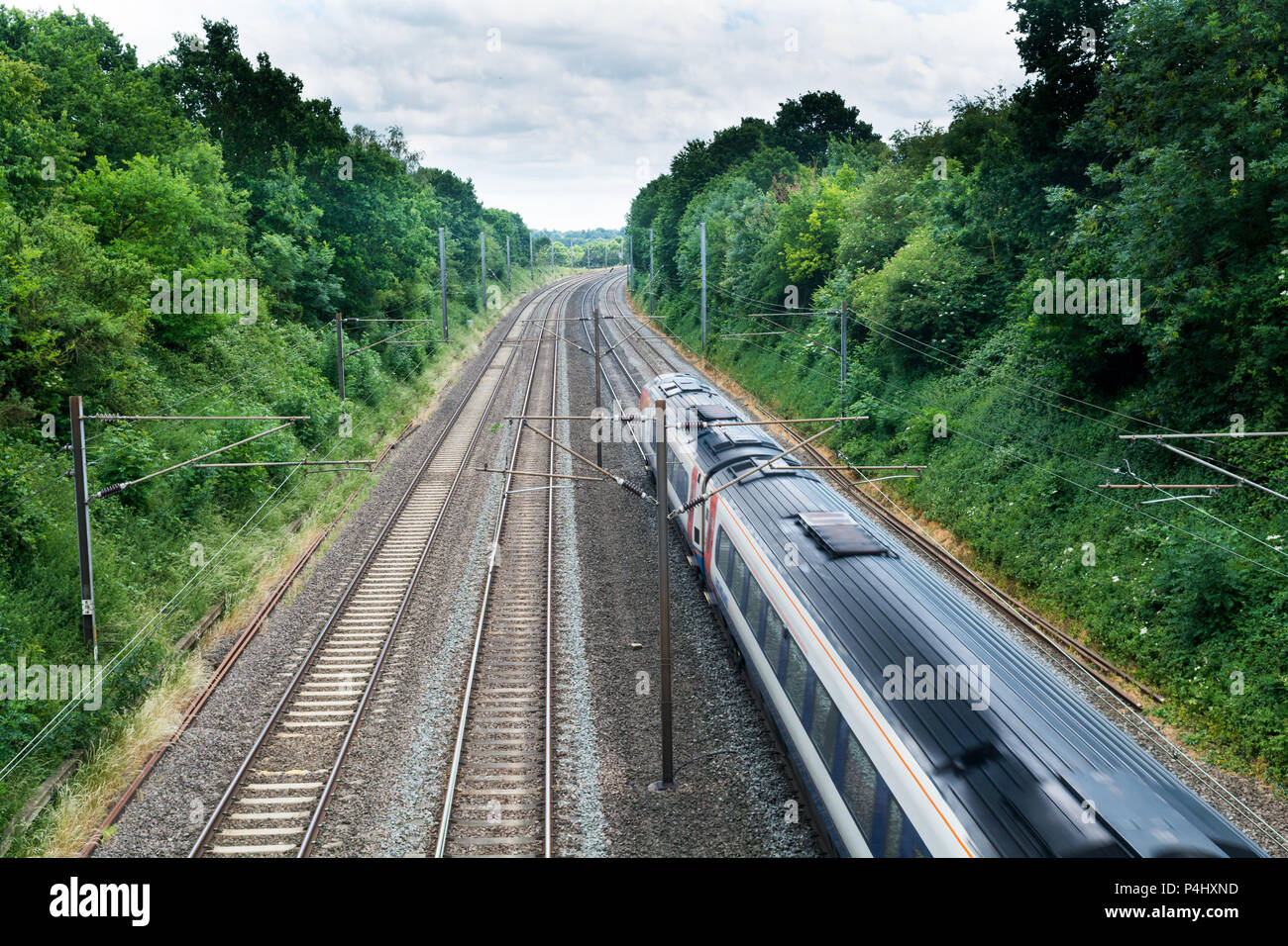 Fast train travelling on the tracks, passenger train Stock Photo - Alamy