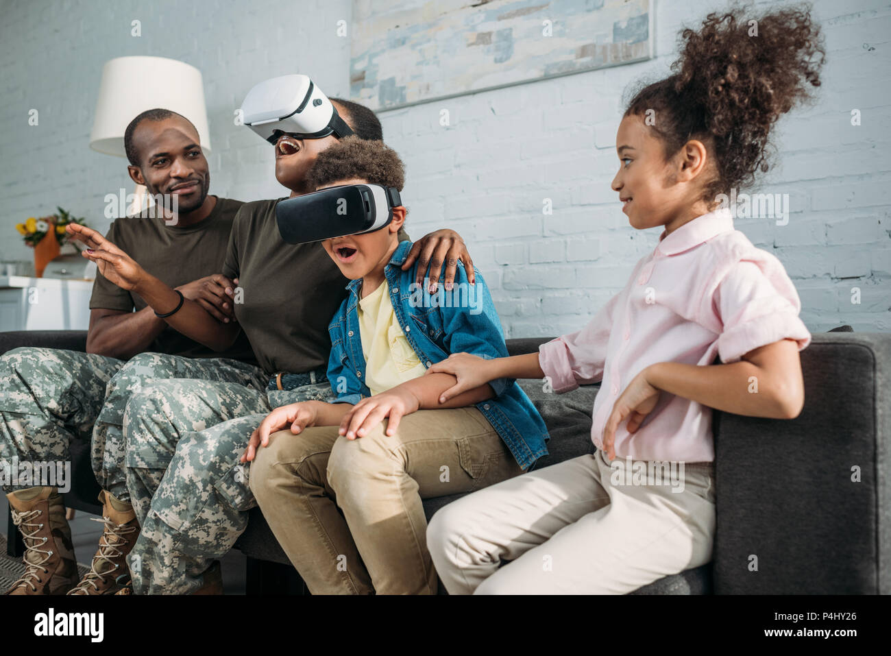 African american female and male soldiers and their children using ...