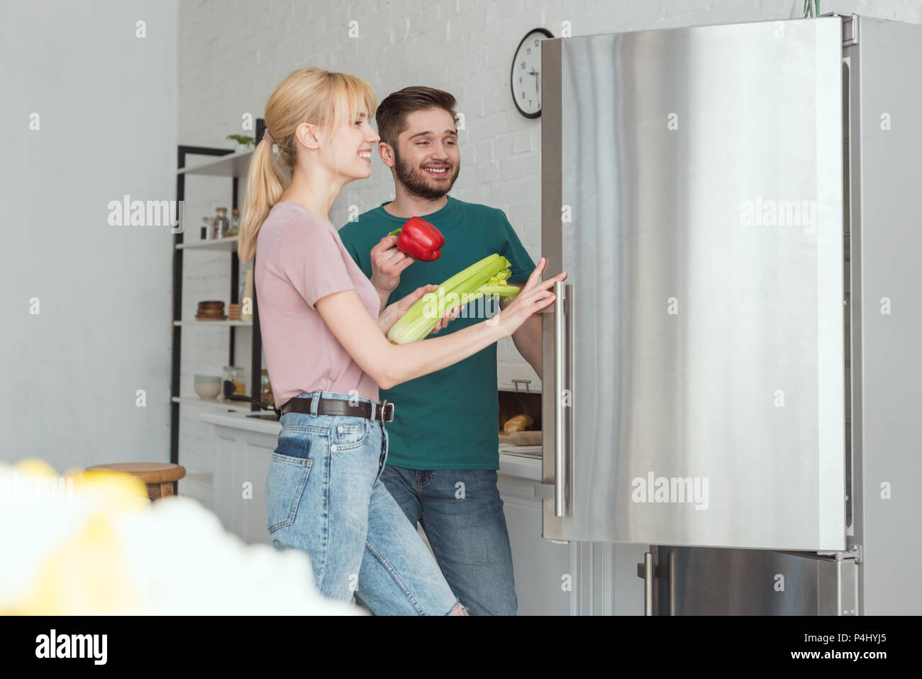 Taking vegetables from fridge hi-res stock photography and images - Alamy