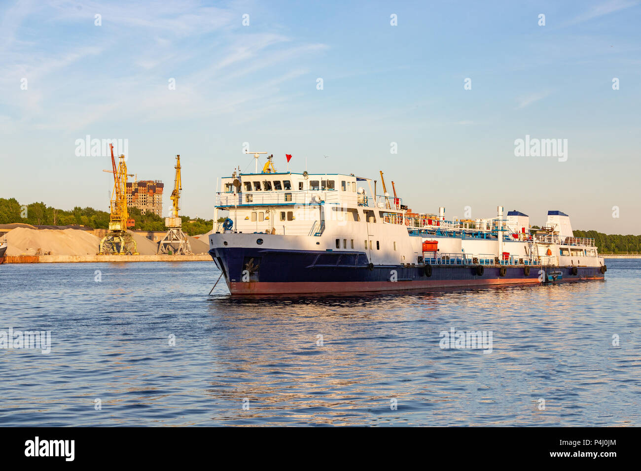 barges and cranes in the river port Stock Photo - Alamy
