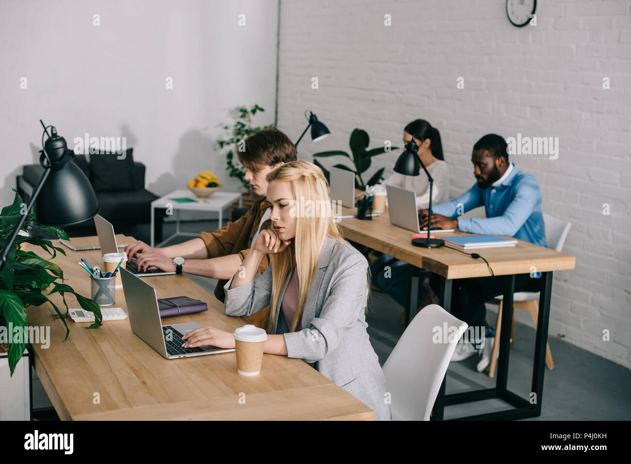 Working laptops table modern office hi-res stock photography and images ...