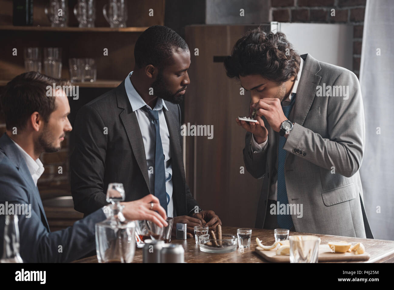 Men in suits drinking hi-res stock photography and images - Alamy