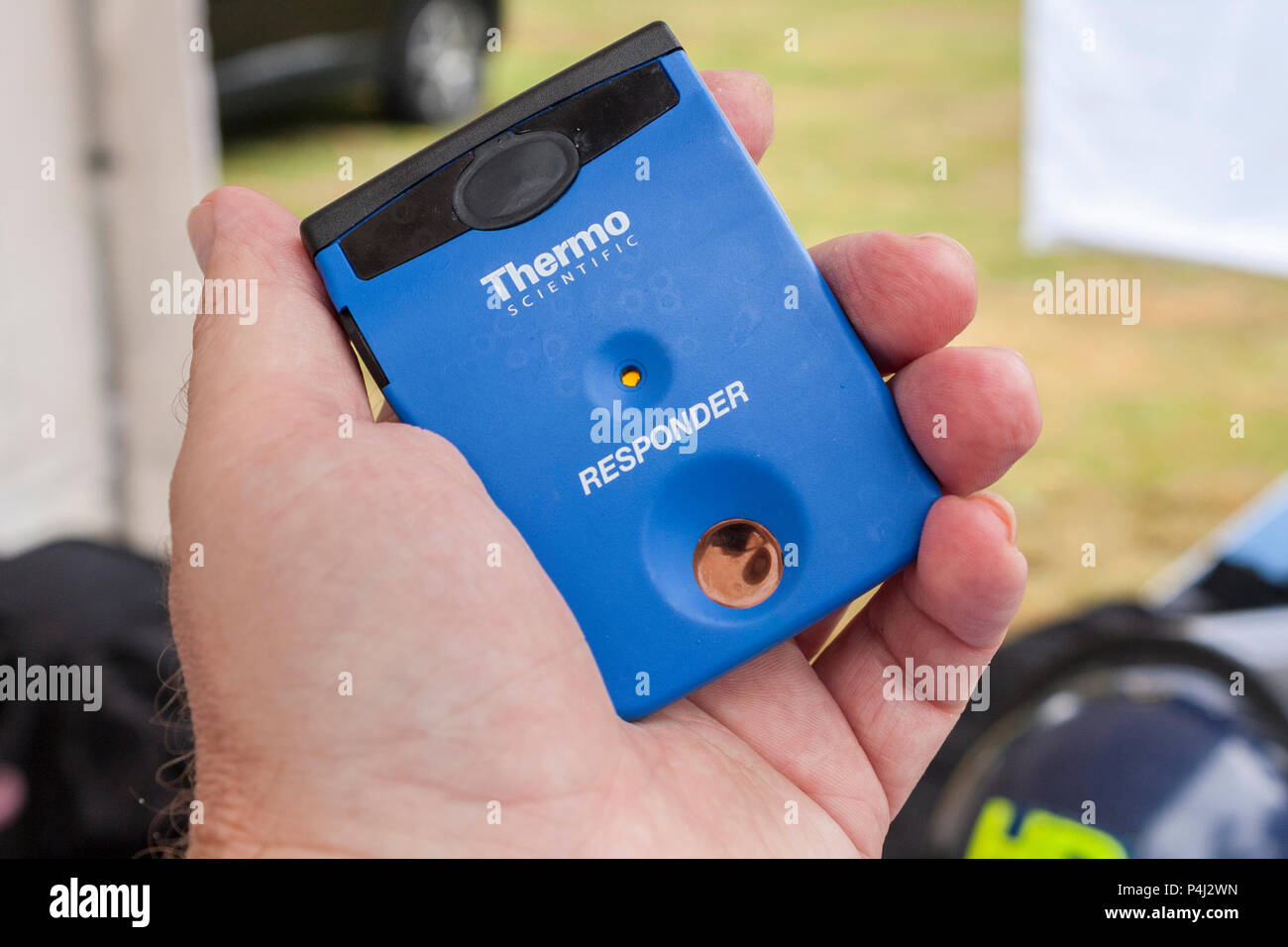 Hand holding a radiation detector - Electronic Personal Dosimeter or ...