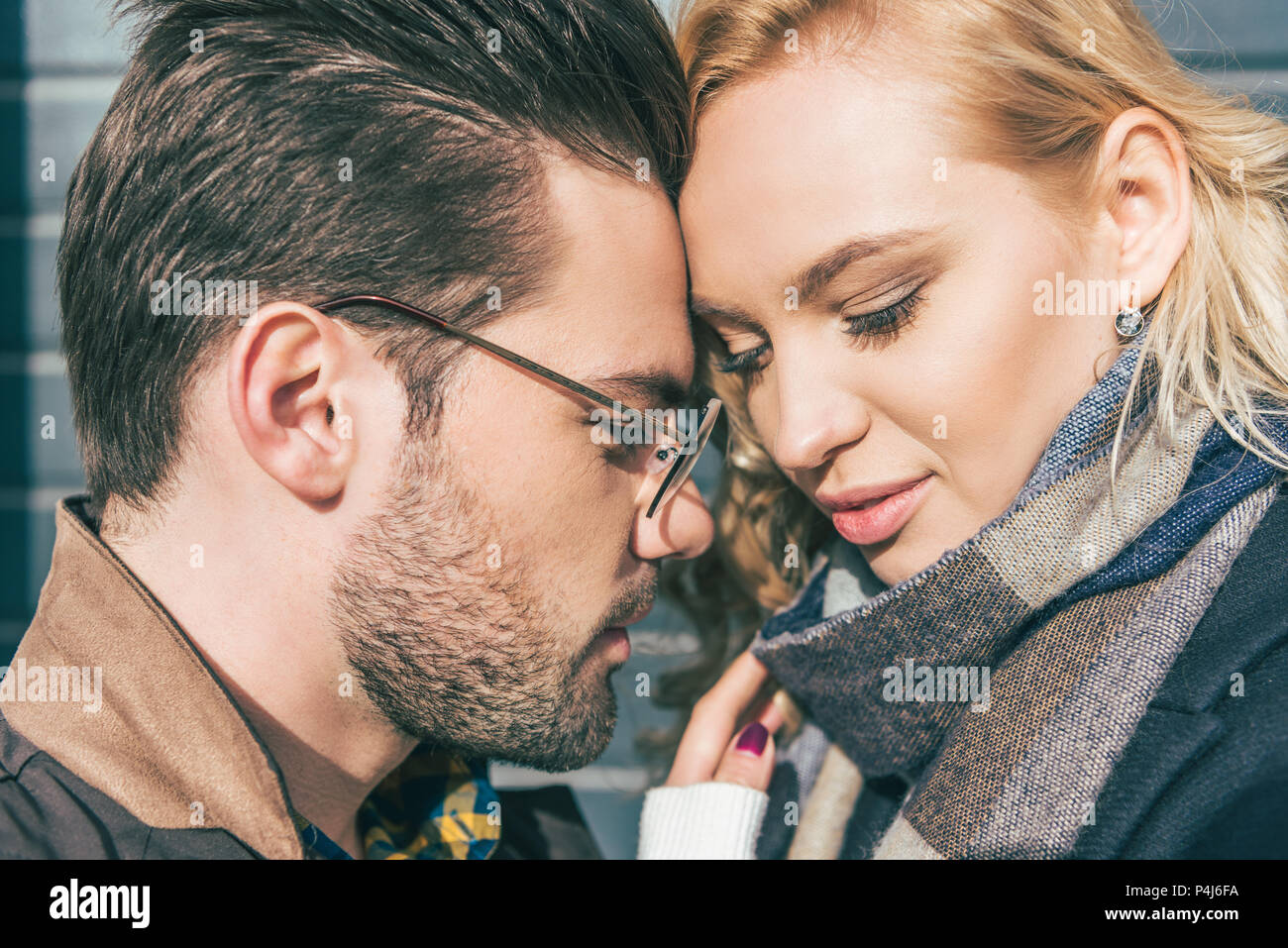 Young couple touching foreheads hi-res stock photography and images - Alamy