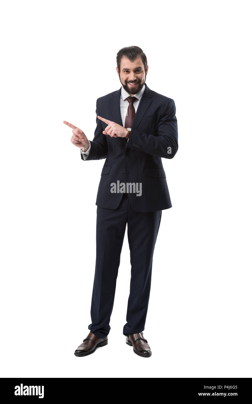 Smiling businessman pointing on something hi-res stock photography and ...