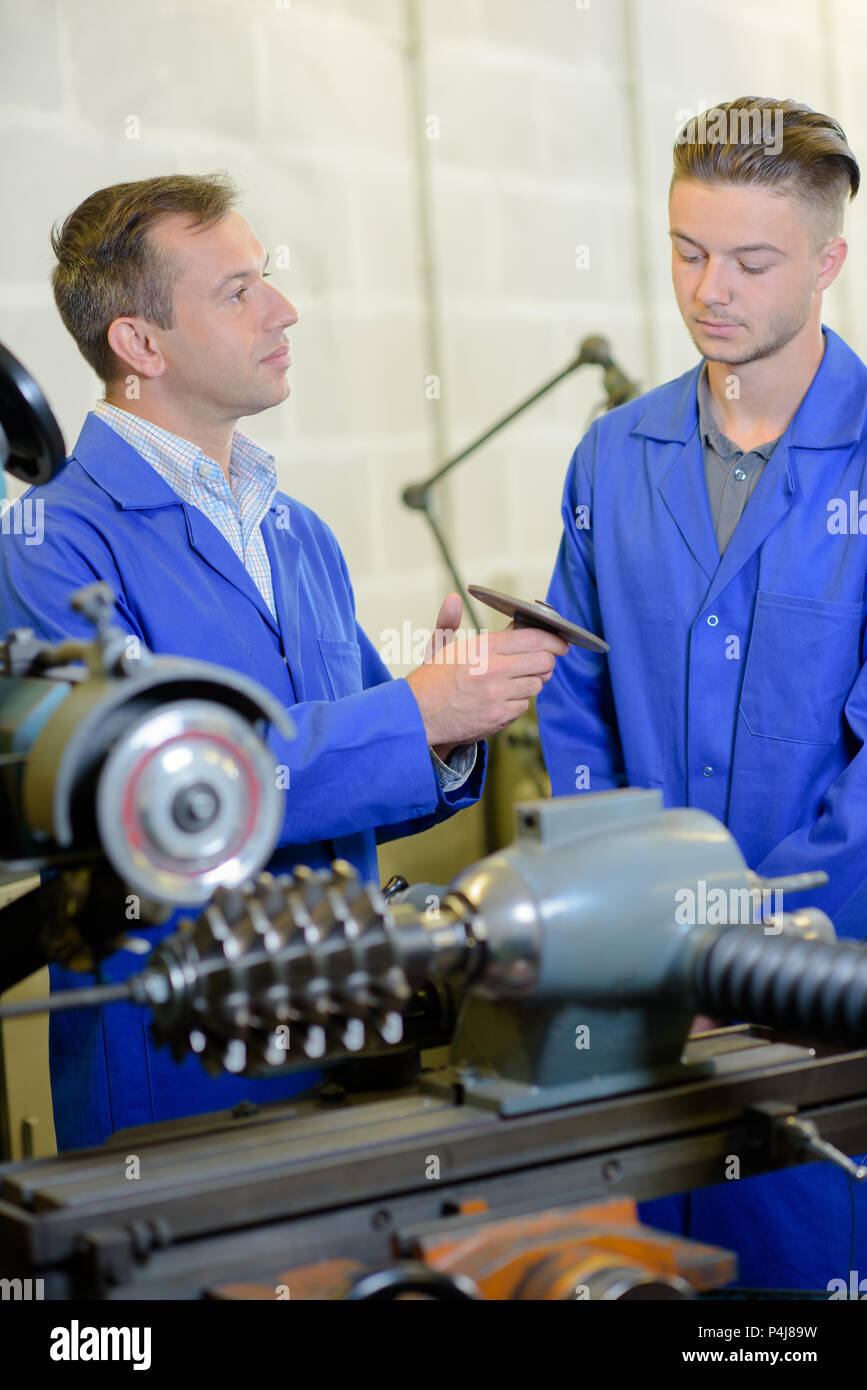 Senior teaching his junior hi-res stock photography and images - Alamy