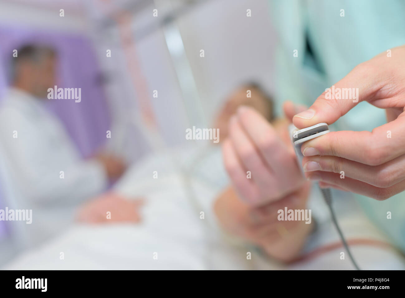 medical device kit attached to the finger of a patient Stock Photo - Alamy