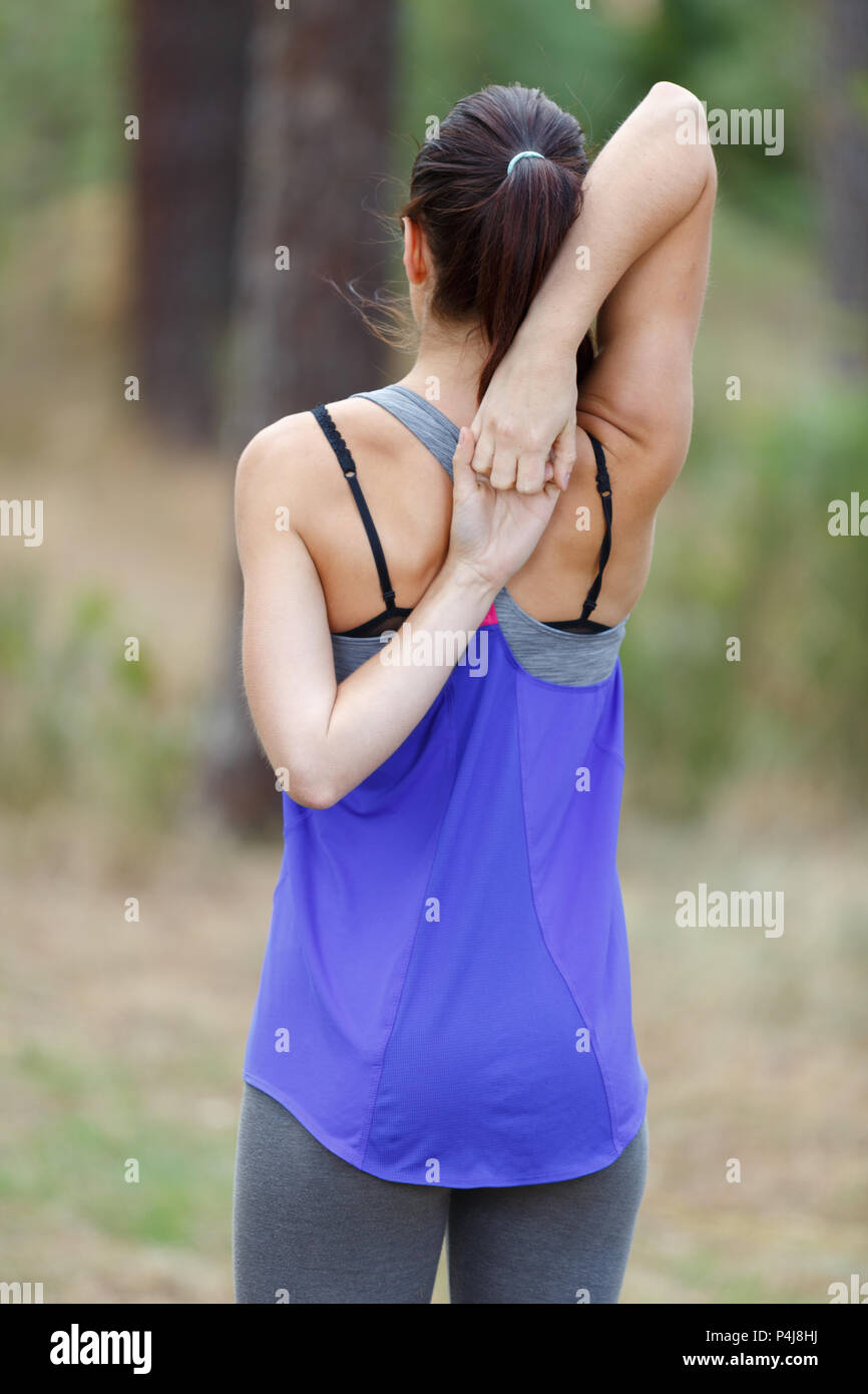 woman making an arm stretch Stock Photo - Alamy