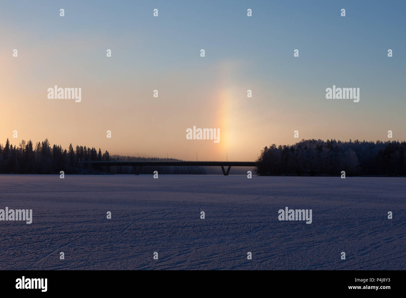 Sundogs at winter on frozen lake Stock Photo - Alamy