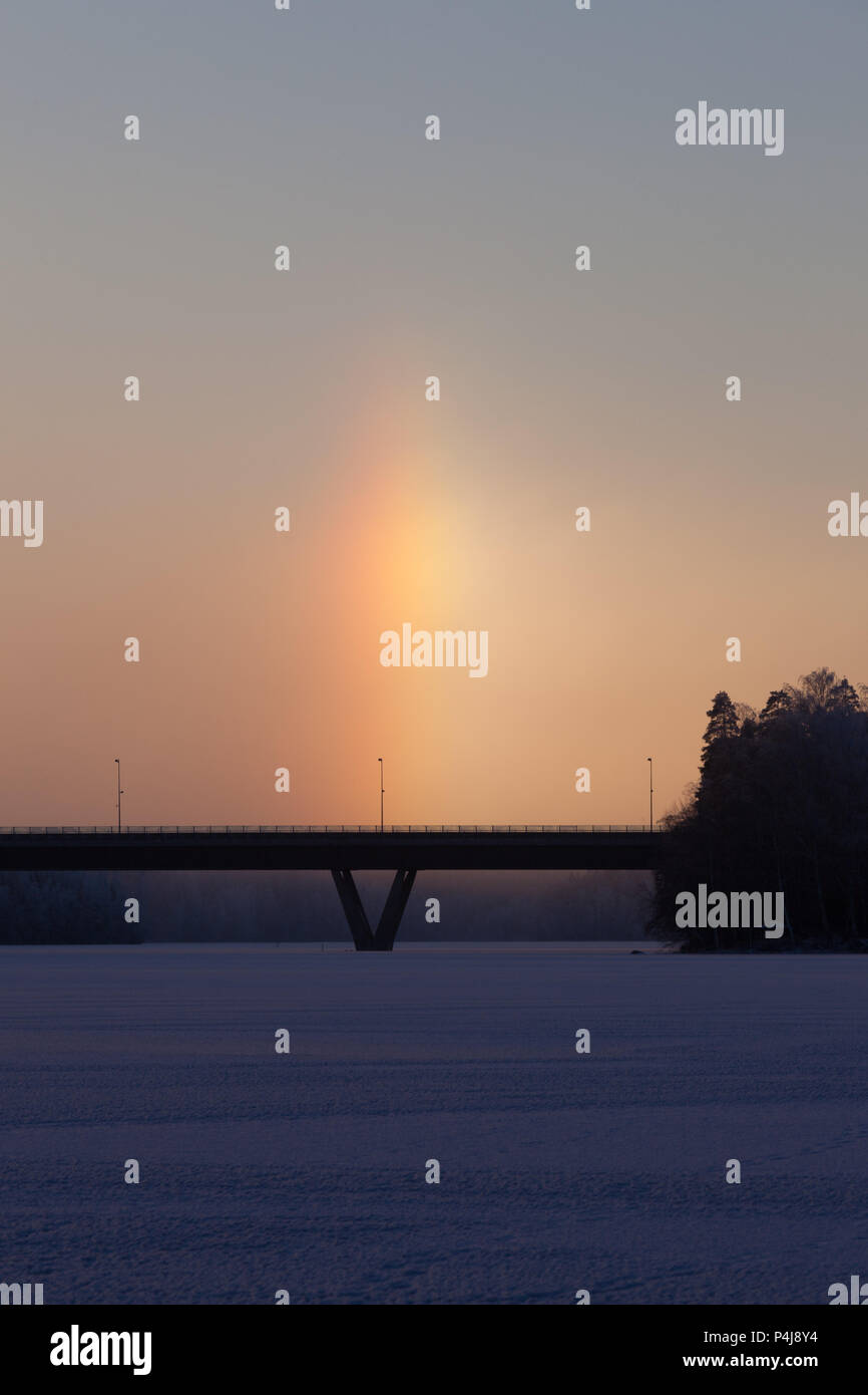 Sundogs at winter on frozen lake Stock Photo - Alamy