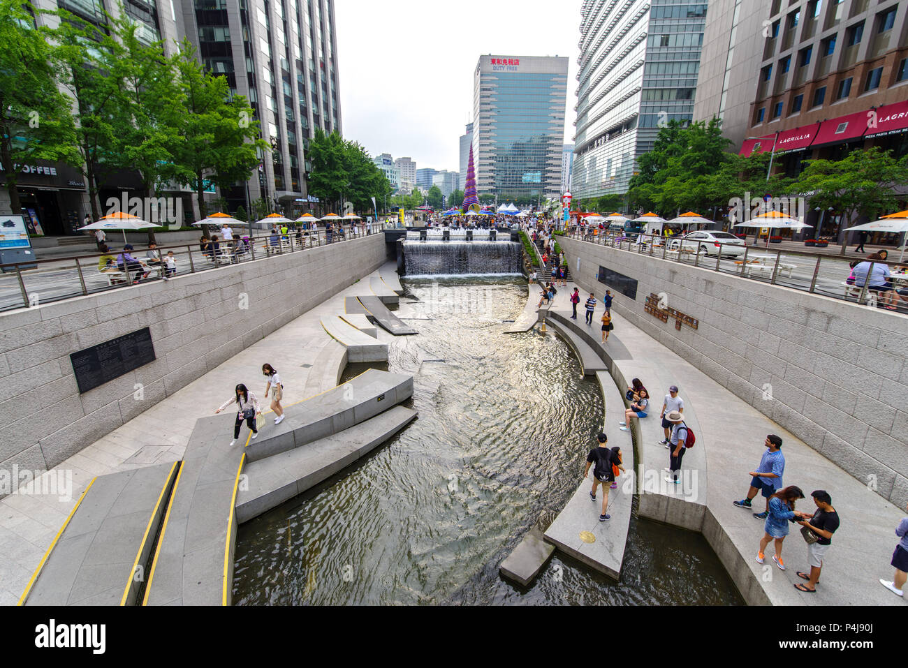Seoul , South Korea : Jun 17, 2018 Citizens resting in the cheonggye ...
