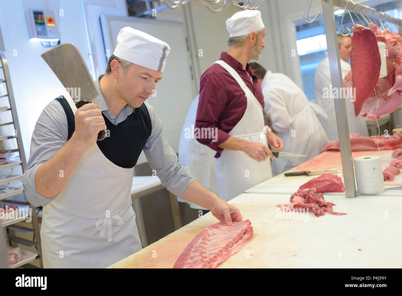 butcher cutting the meat Stock Photo - Alamy