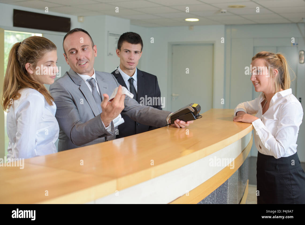 the young receptionist Stock Photo - Alamy