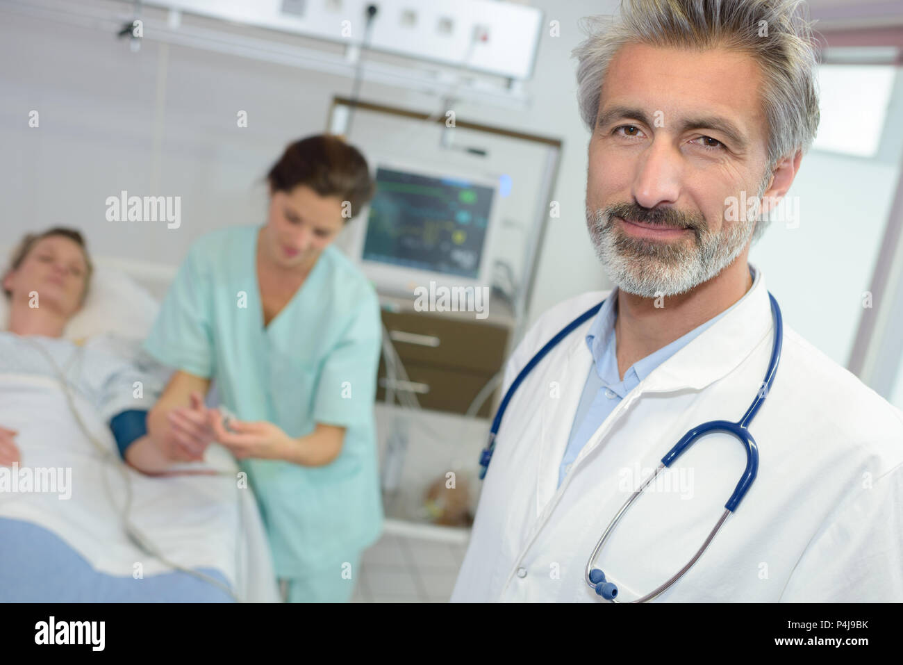good looking latin doctor standing in a hospital room Stock Photo - Alamy