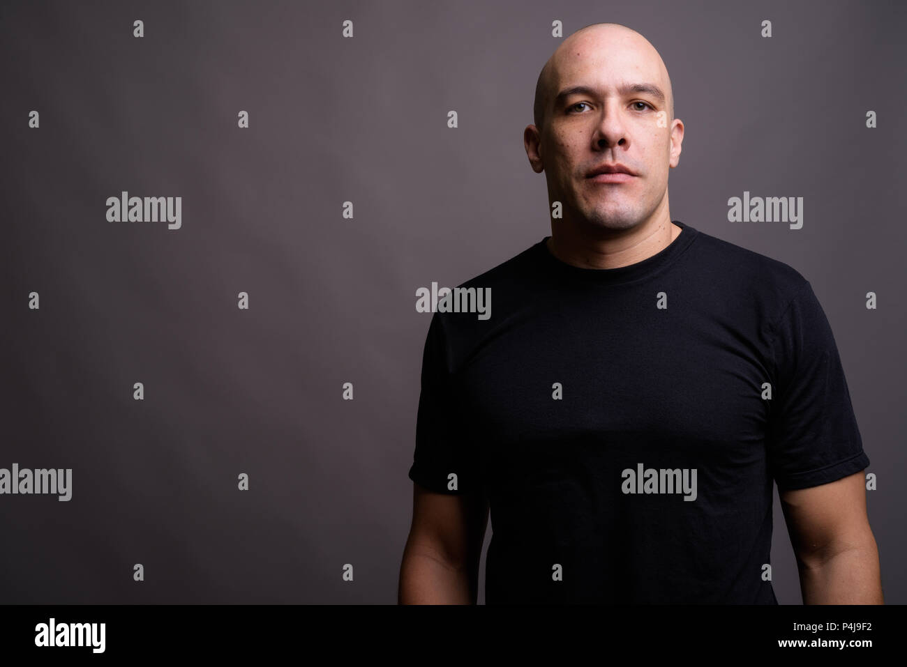 Strong bald man hi-res stock photography and images - Alamy