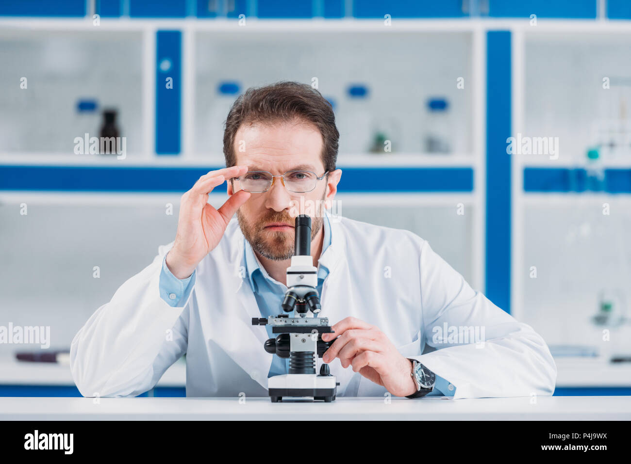 Scientist in eyeglasses white coat hi-res stock photography and images ...