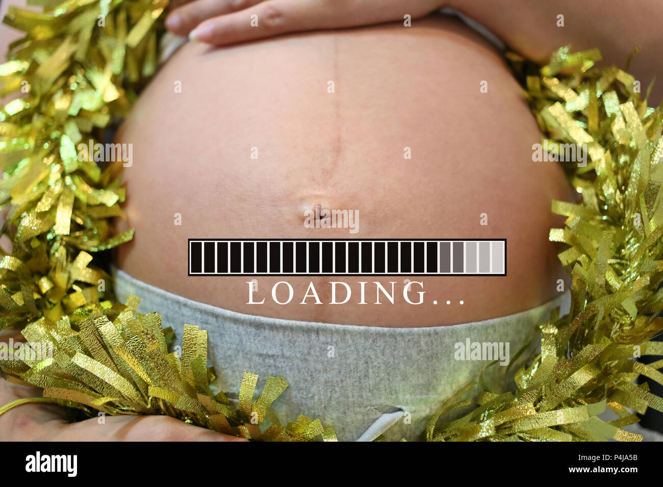 Belly of pregnant women and loading text in concept of time in ...