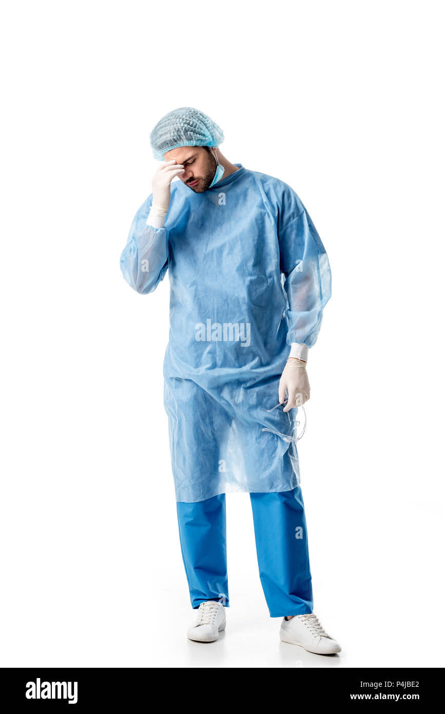 Upset surgeon wearing blue uniform isolated on white Stock Photo - Alamy