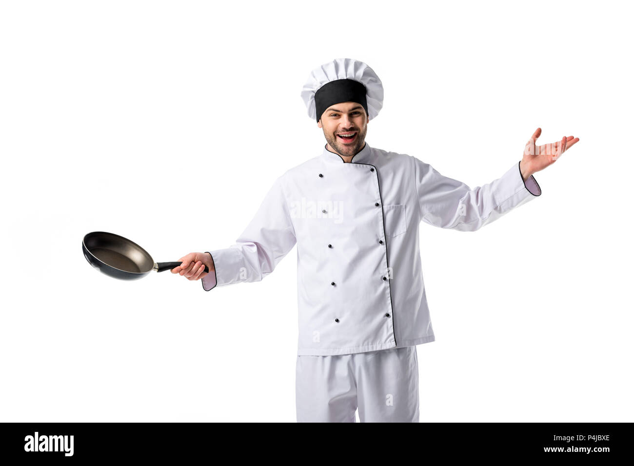 portrait of smiling young chef in uniform with frying pan isolated on ...