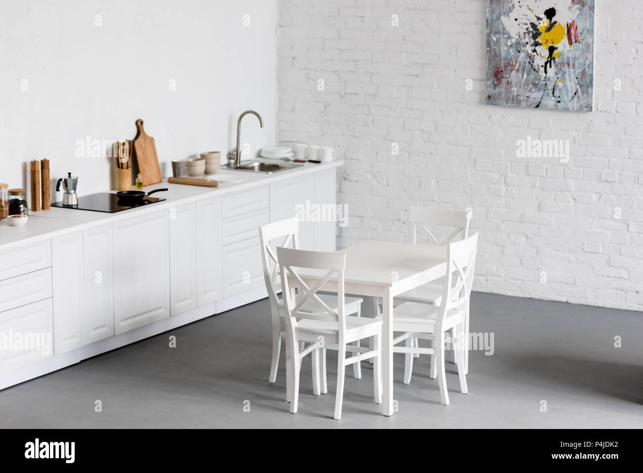 white dining table at modern kitchen with white brick walls Stock Photo ...
