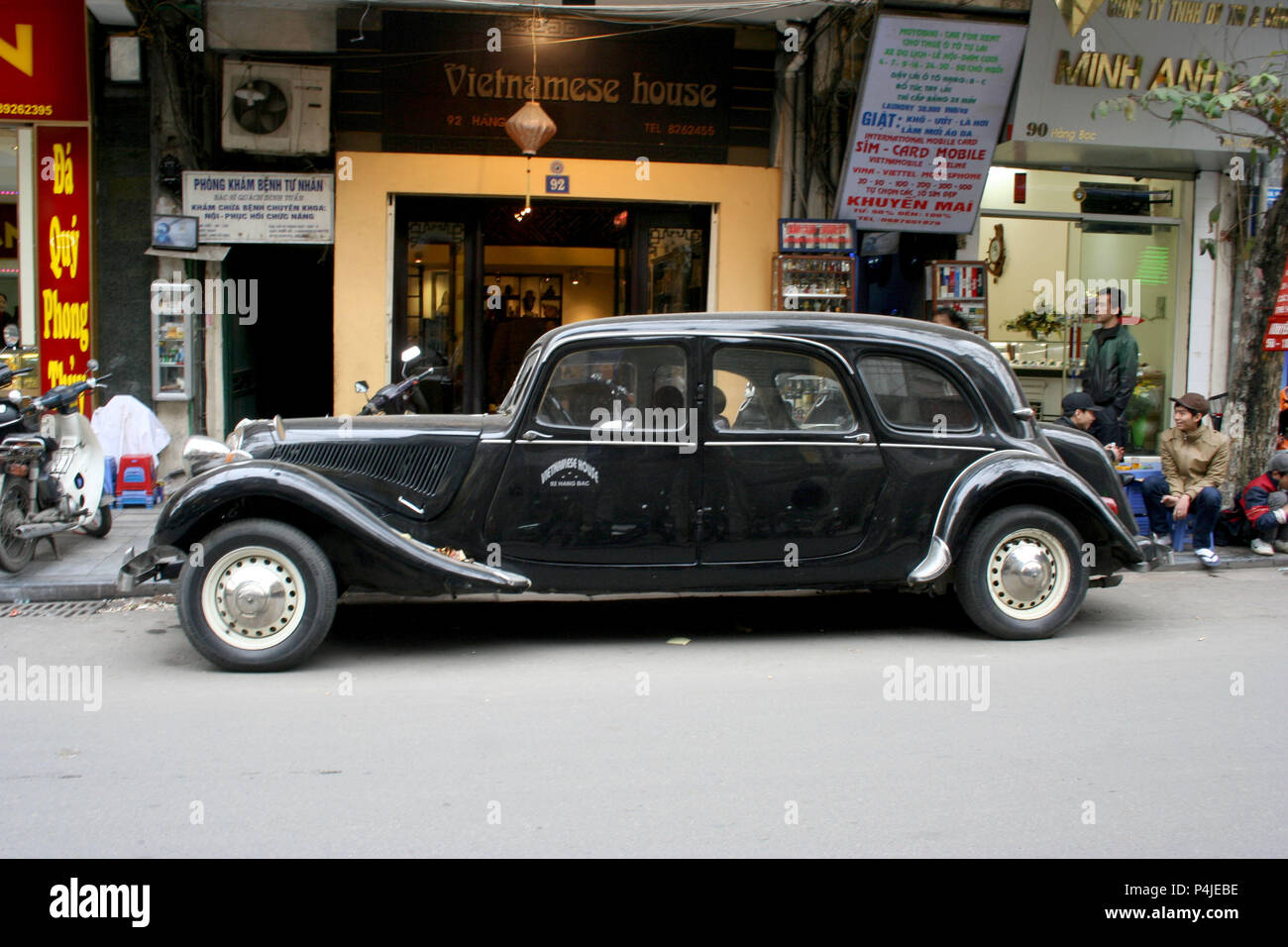 Black vintage car in street, Hanoi, Vietnam Stock Photo - Alamy