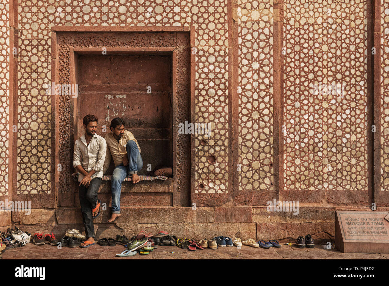 2 indian caretaker of shoes at Buland at Darwaza Stock Photo - Alamy