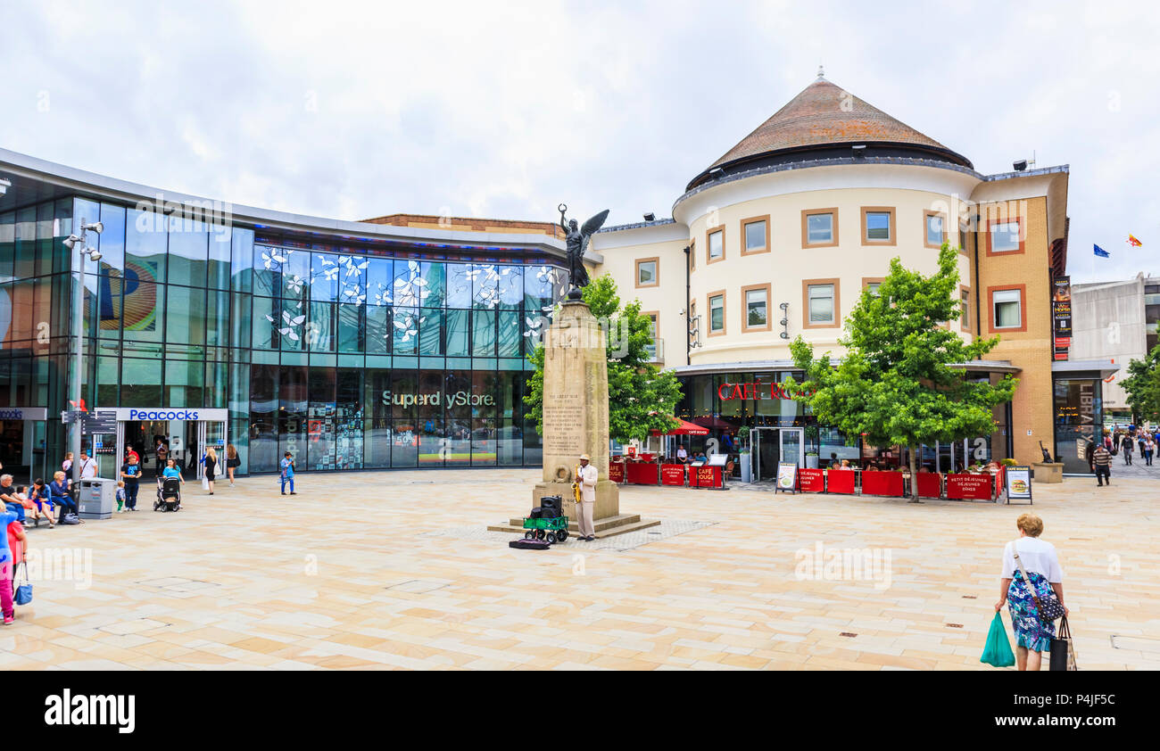 Busker playing a saxaphone by the war memorial in Jubilee Square by the ...