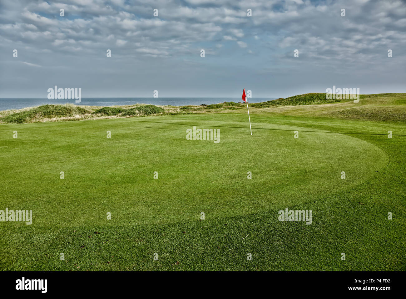 Golf courses running along the sea Stock Photo - Alamy