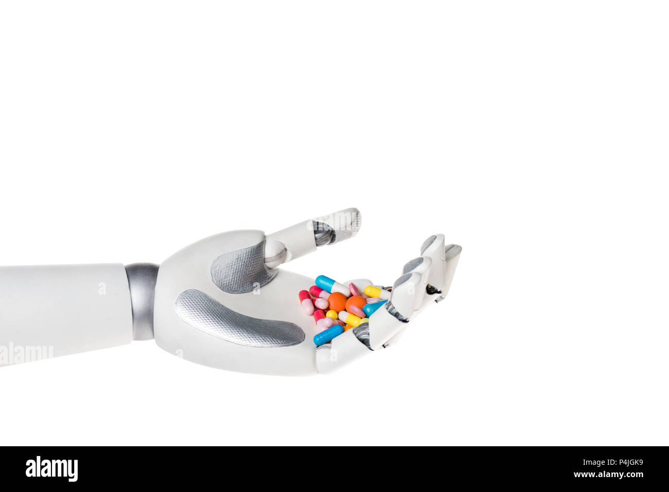 robot hand holding colored different pills isolated on white Stock ...