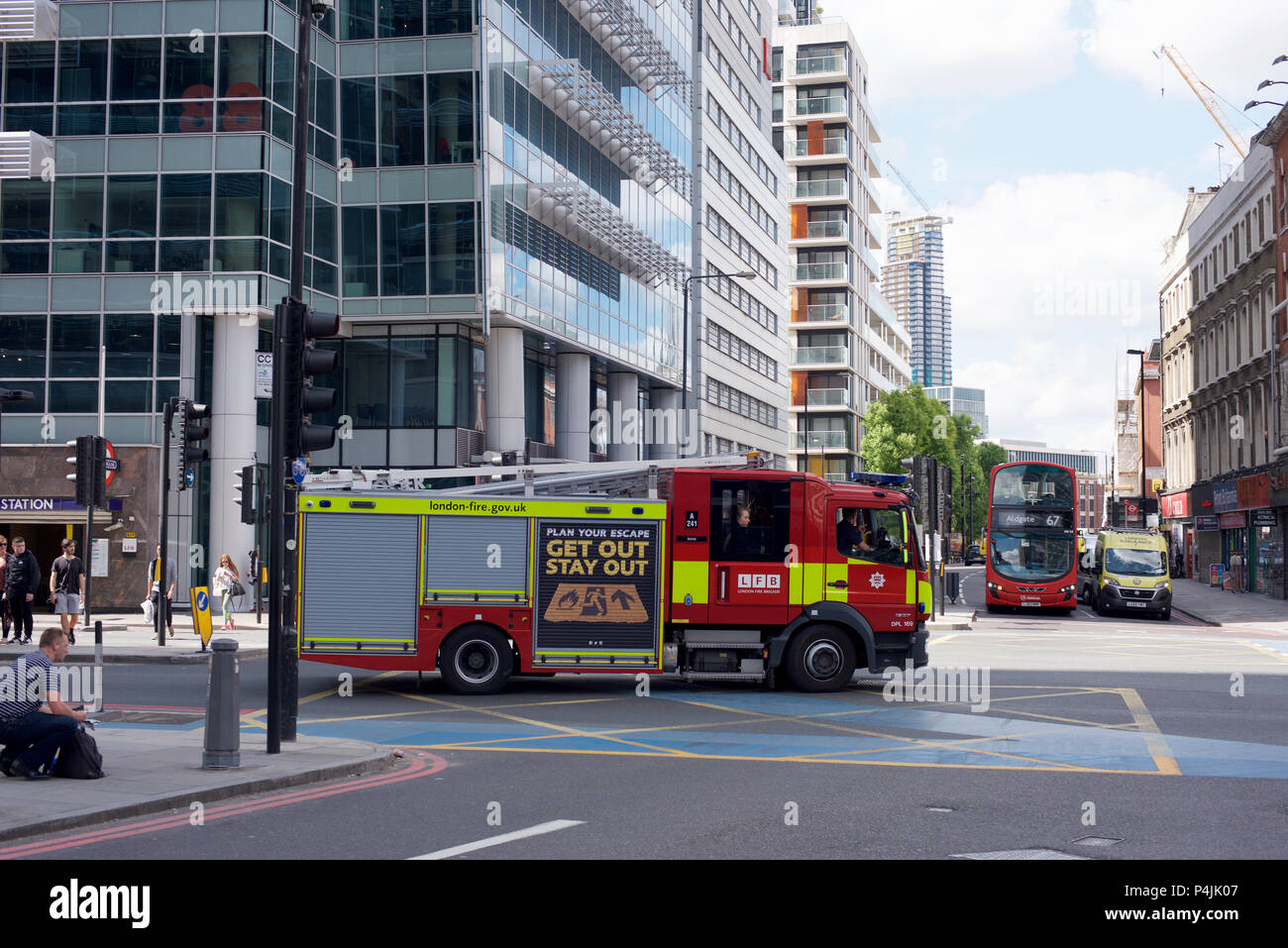 Fire engine on an emergency call in Whitechapel High Street in London ...