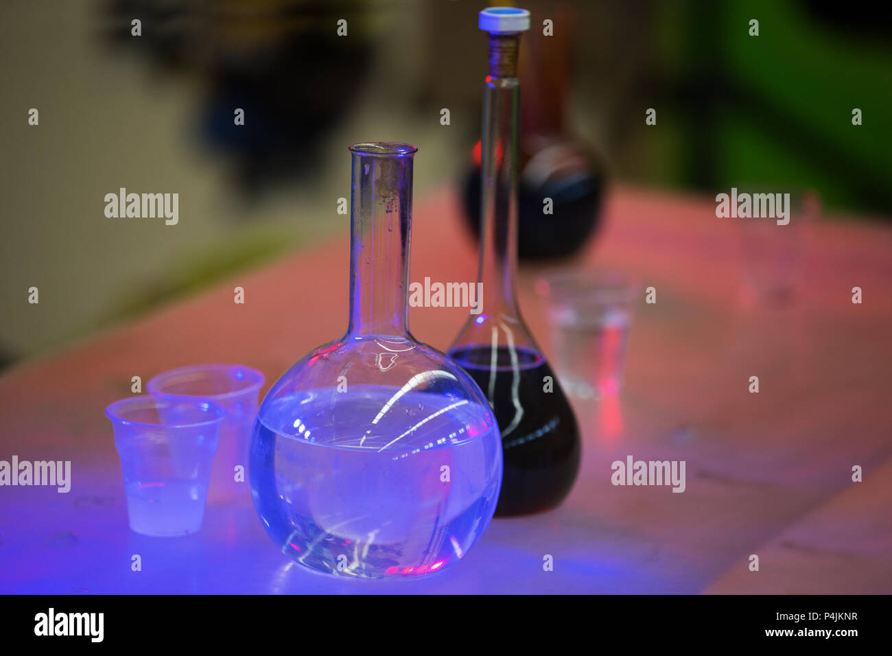 Glass bulbs in blue lighting for experiments.Test flasks Stock Photo ...
