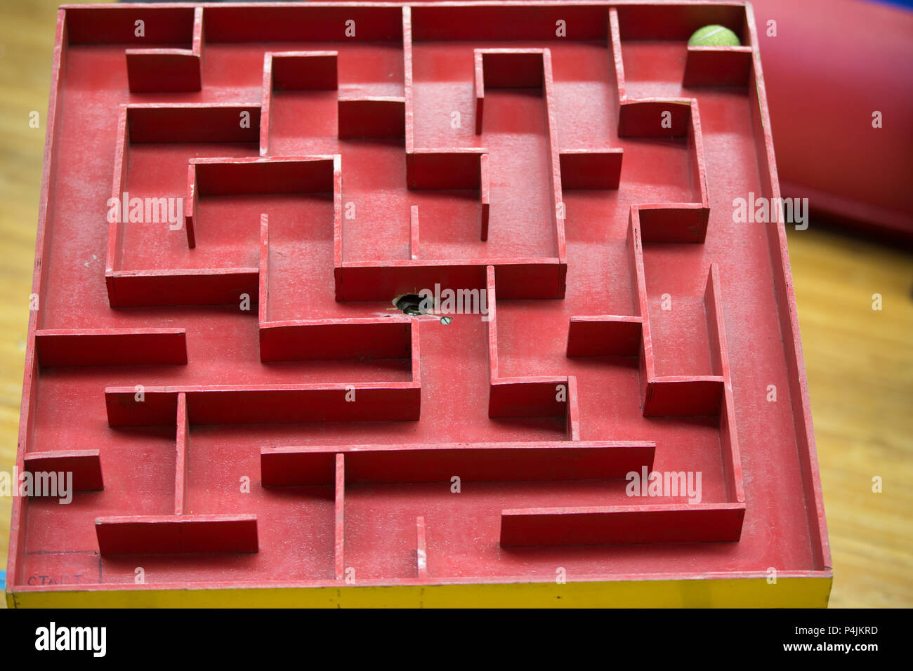 Wooden labyrinth with a ball Stock Photo - Alamy
