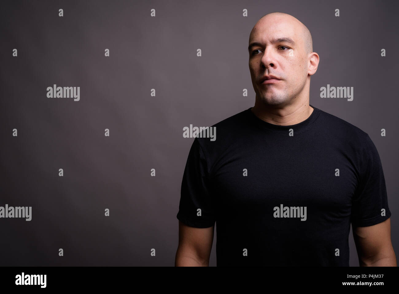 Strong bald man hi-res stock photography and images - Alamy