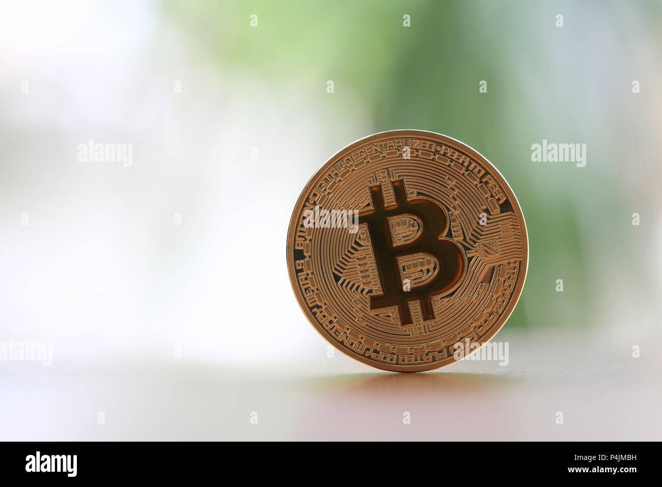 Golden Medal of bitcoin on wooden floor and have copy space for design ...