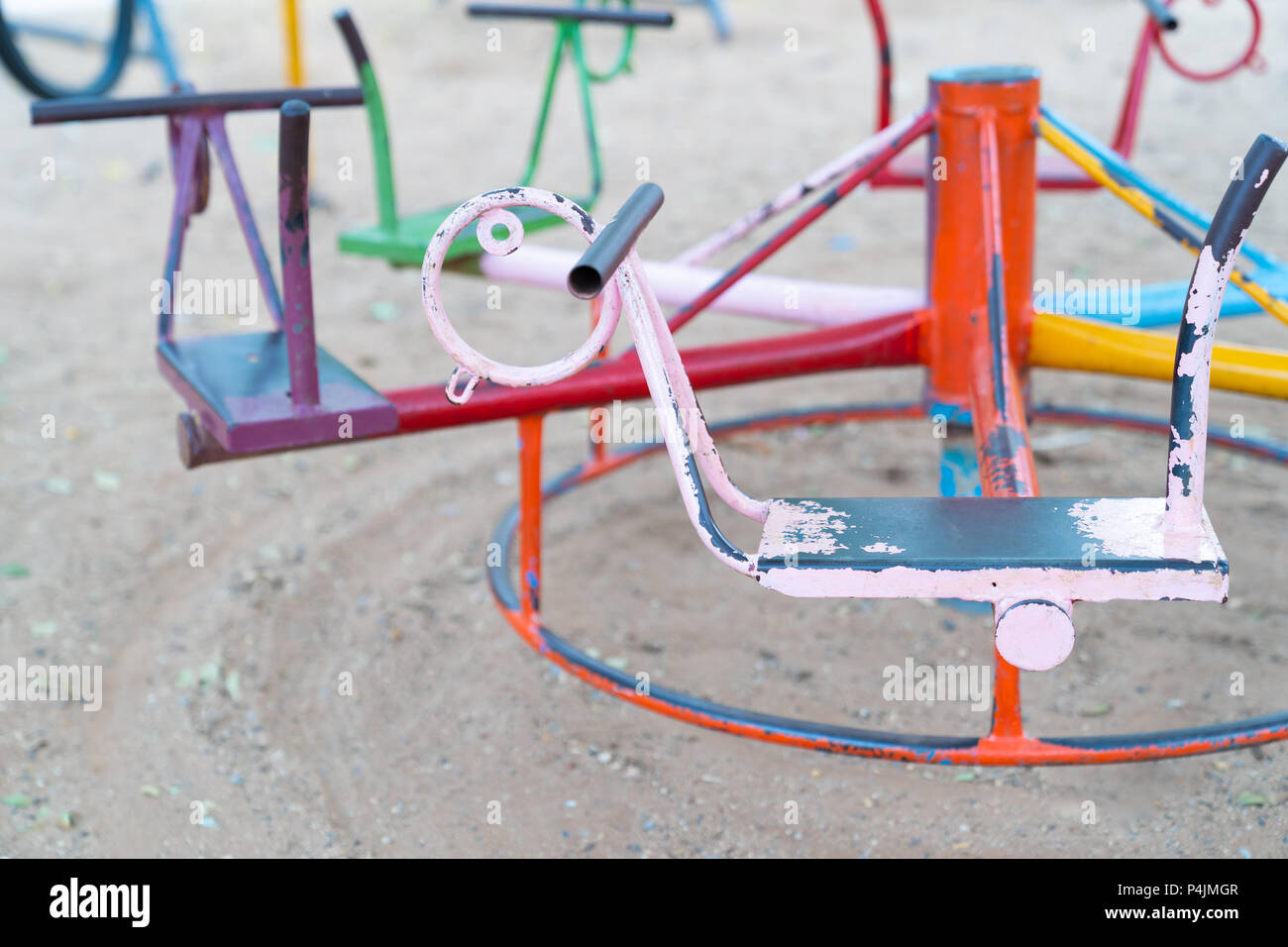 Old horse carousel on playground at school Stock Photo - Alamy