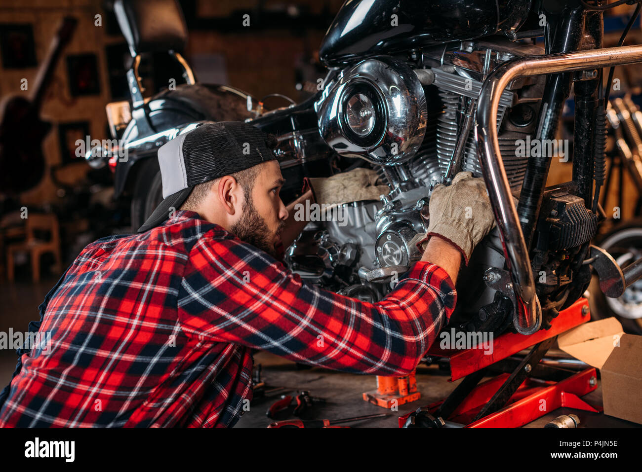 close-up shot of bike repair station worker fixing motorcycle Stock ...
