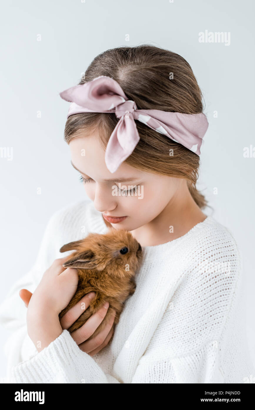 close-up view of beautiful teenage girl holding adorable furry rabbit ...