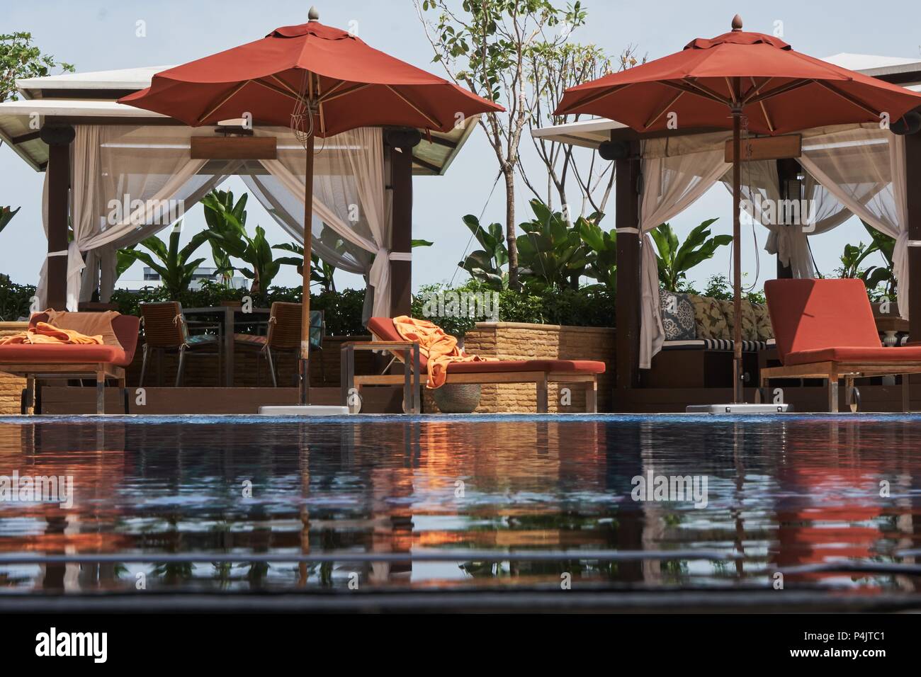 Reflections by a swimming pool Stock Photo - Alamy