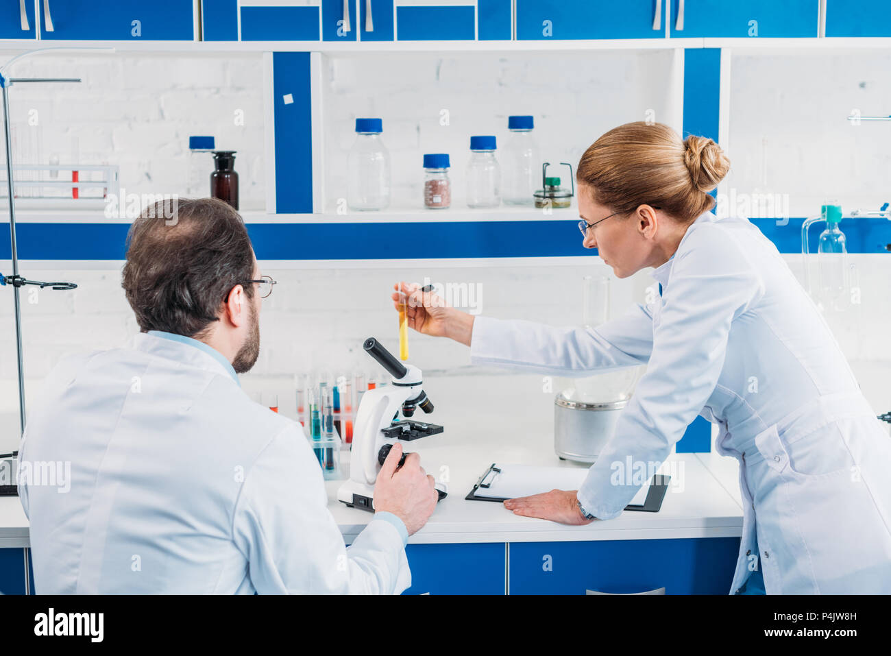 Scientists lab back view hi-res stock photography and images - Alamy