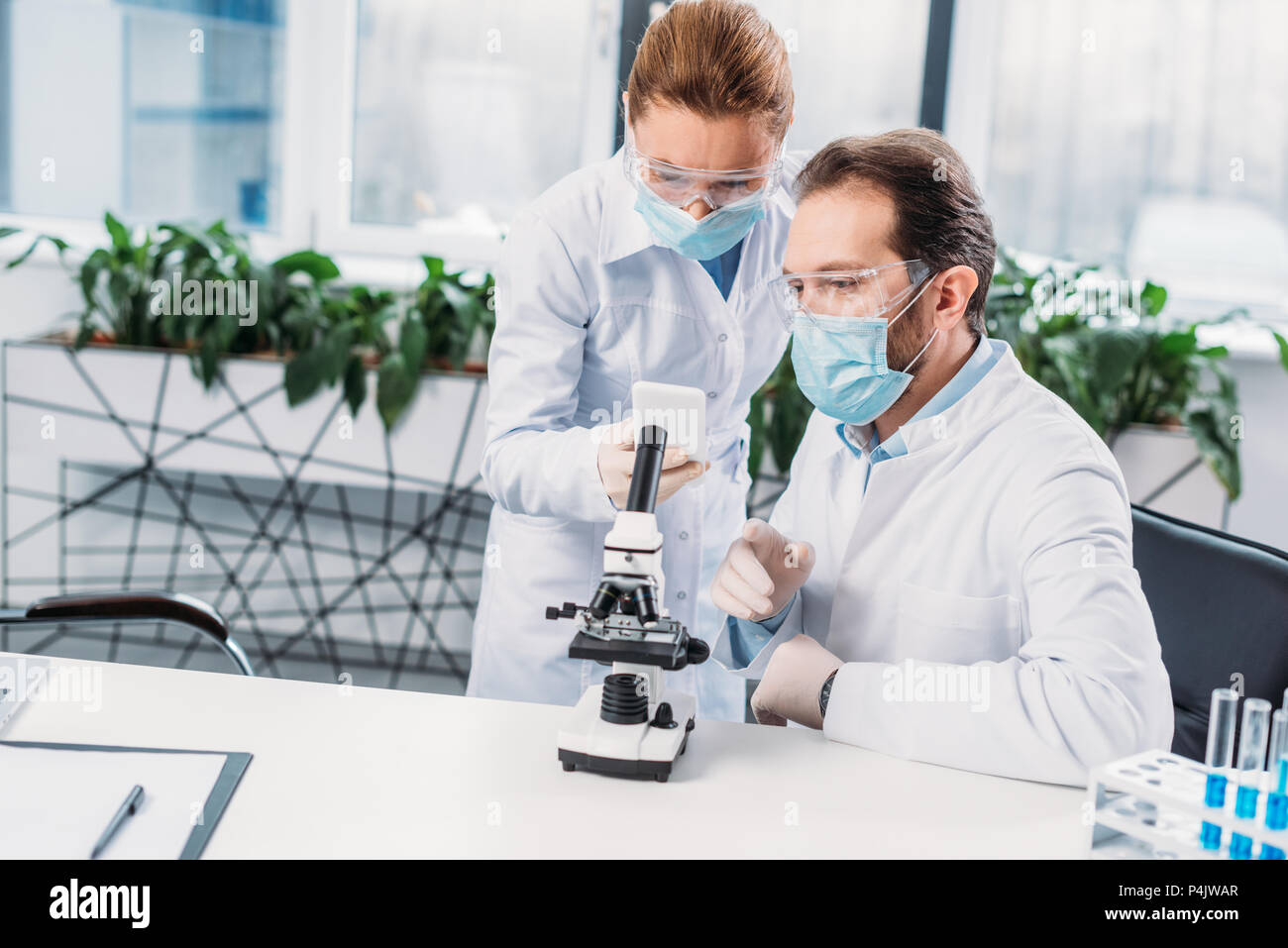 Medical researchers working together hi-res stock photography and ...