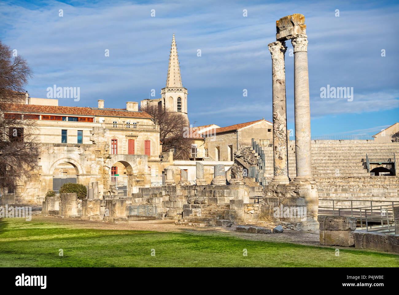 Ancient roman columns and amphitheatre in Arles, France Stock Photo - Alamy