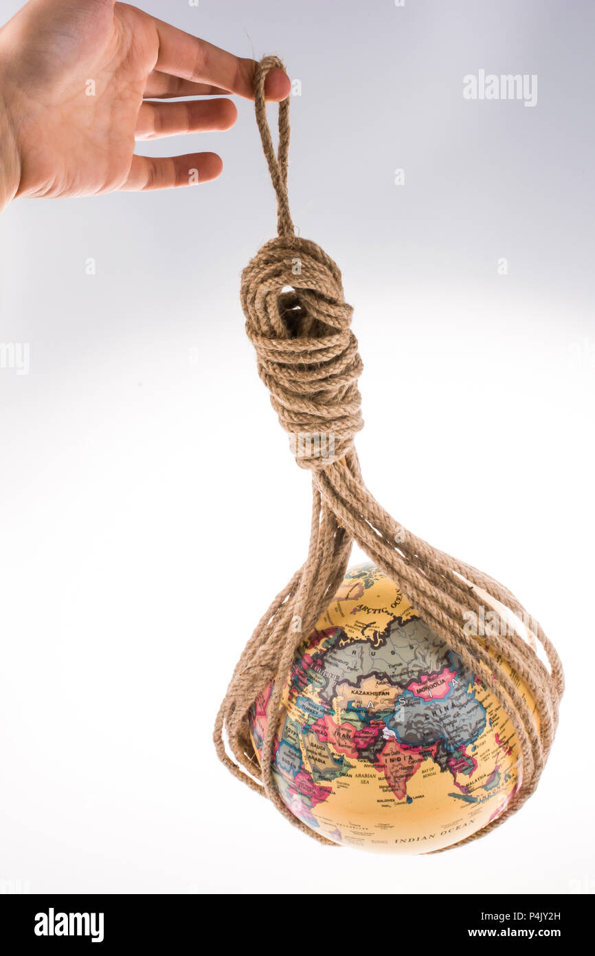 globe hanging in rope on white background Stock Photo - Alamy