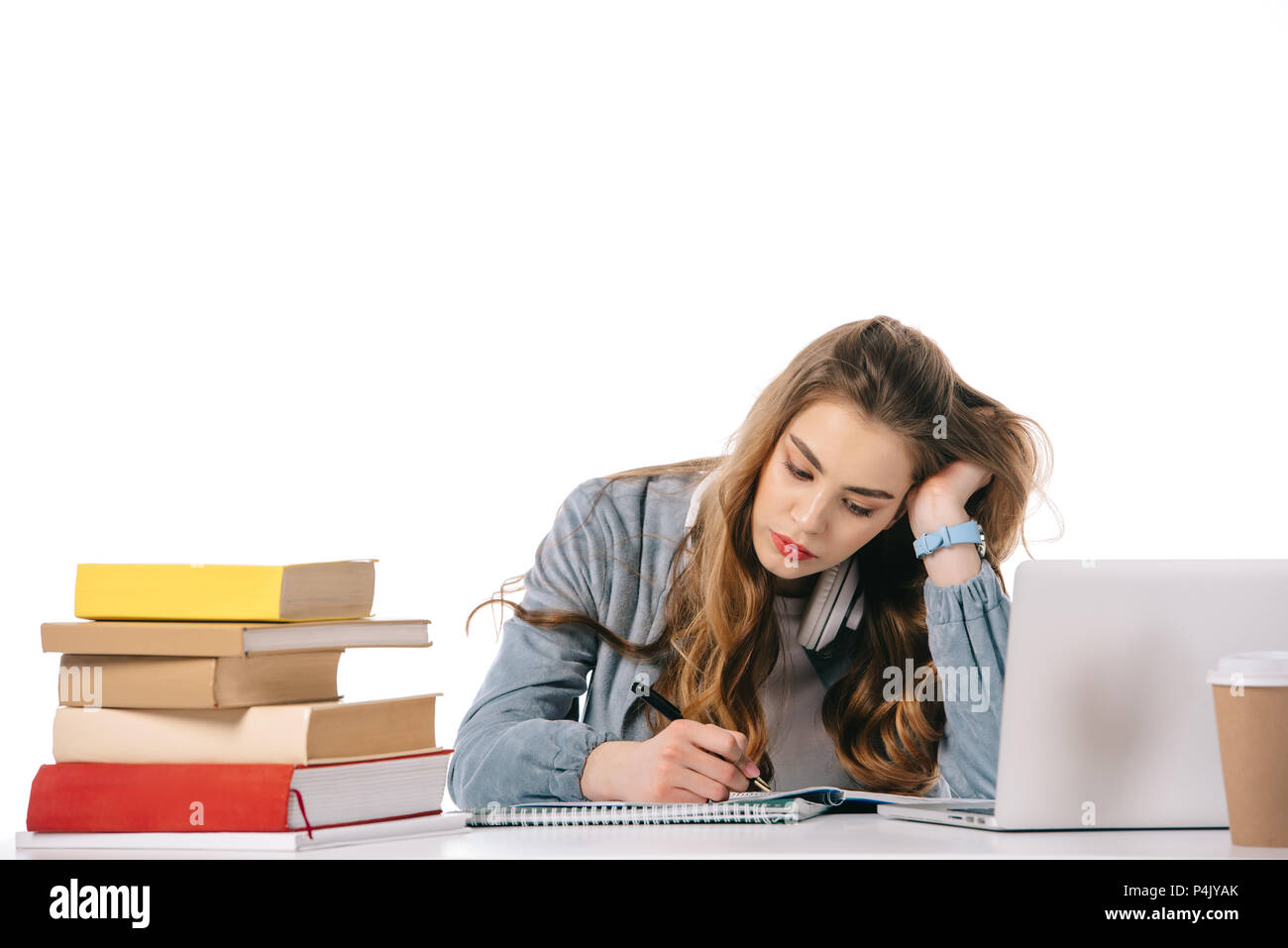 tired student writing something at table isolated on white Stock Photo ...