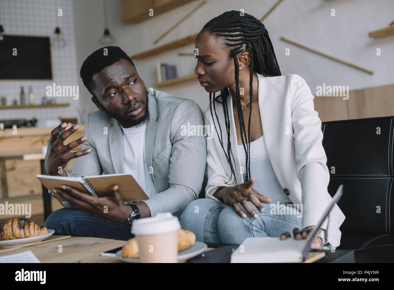 african american businesspeople discussing work during business meeting ...