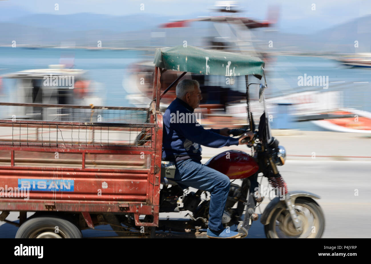 Speeding Scooters on Fetihye harbour Stock Photo - Alamy