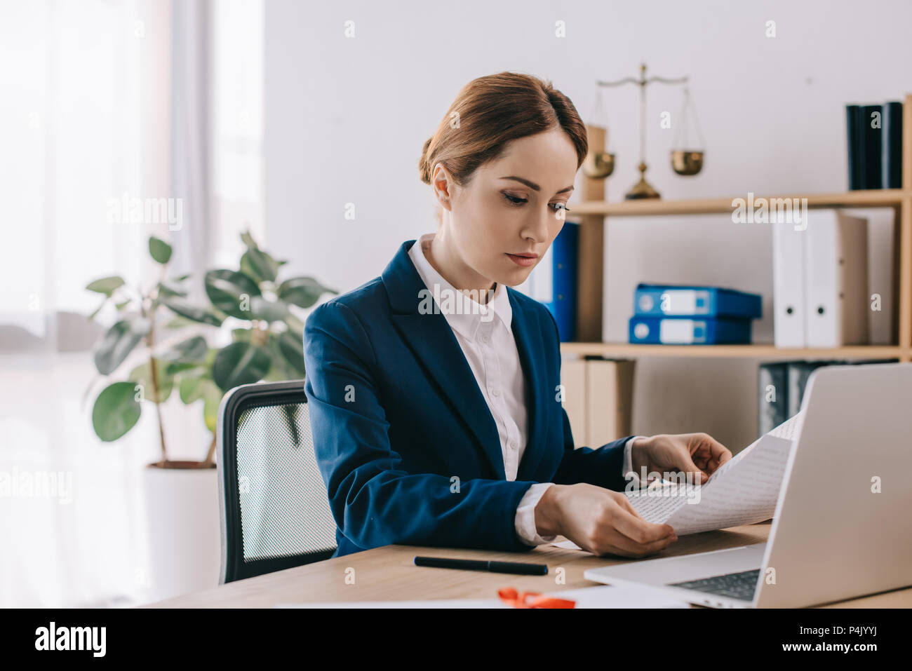 Professional female lawyer working documents hi-res stock photography ...